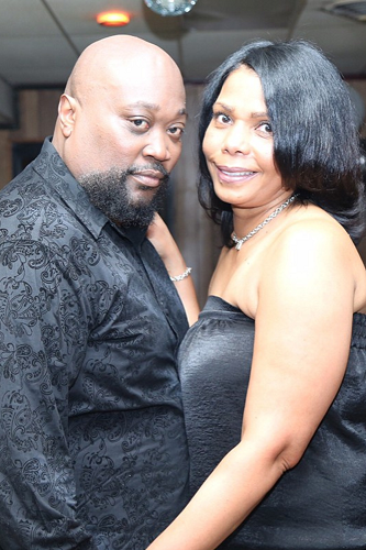 Rodney And Trina Taylor Clad In Similar Color Outfits As They Attend A ...