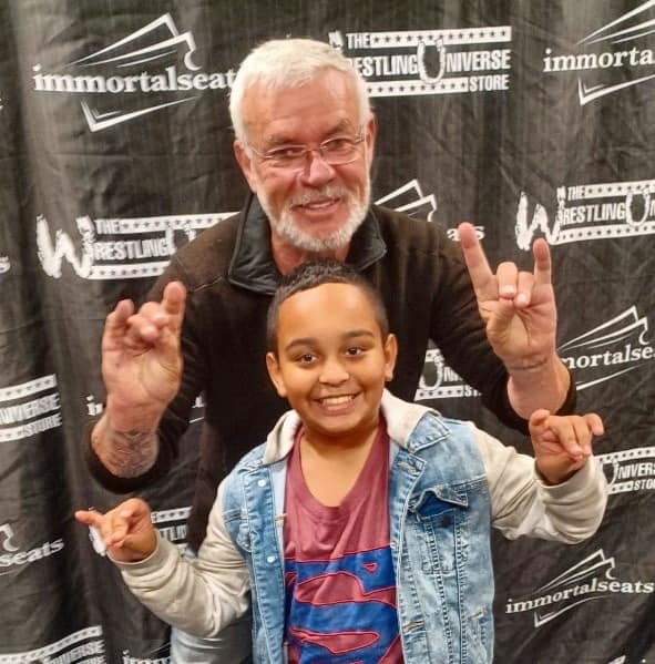 Eric Bischoff Posing With A Fan In A Wrestling Event - Players Bio
